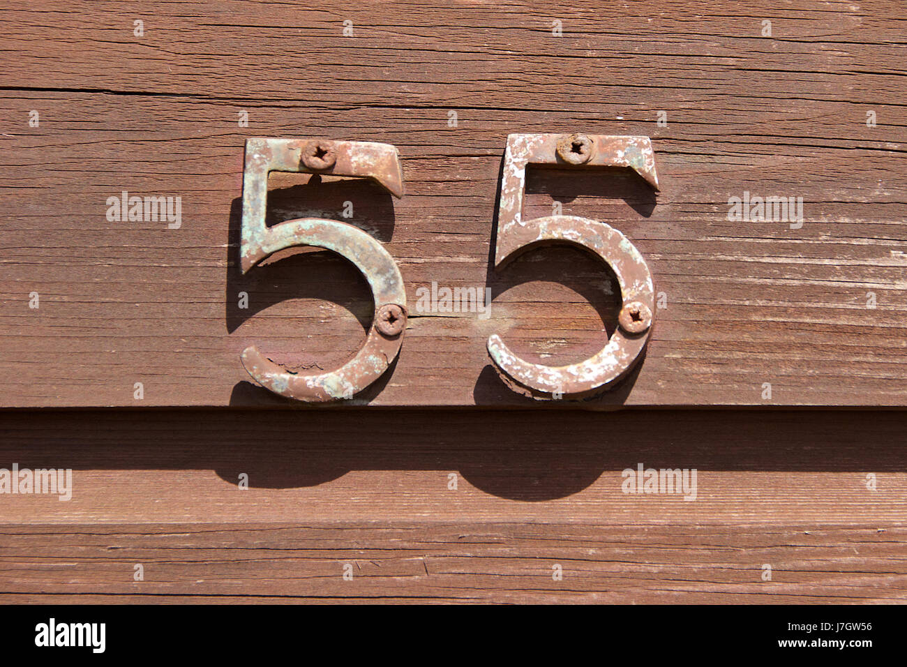 The number 55 on a beach hut Stock Photo - Alamy