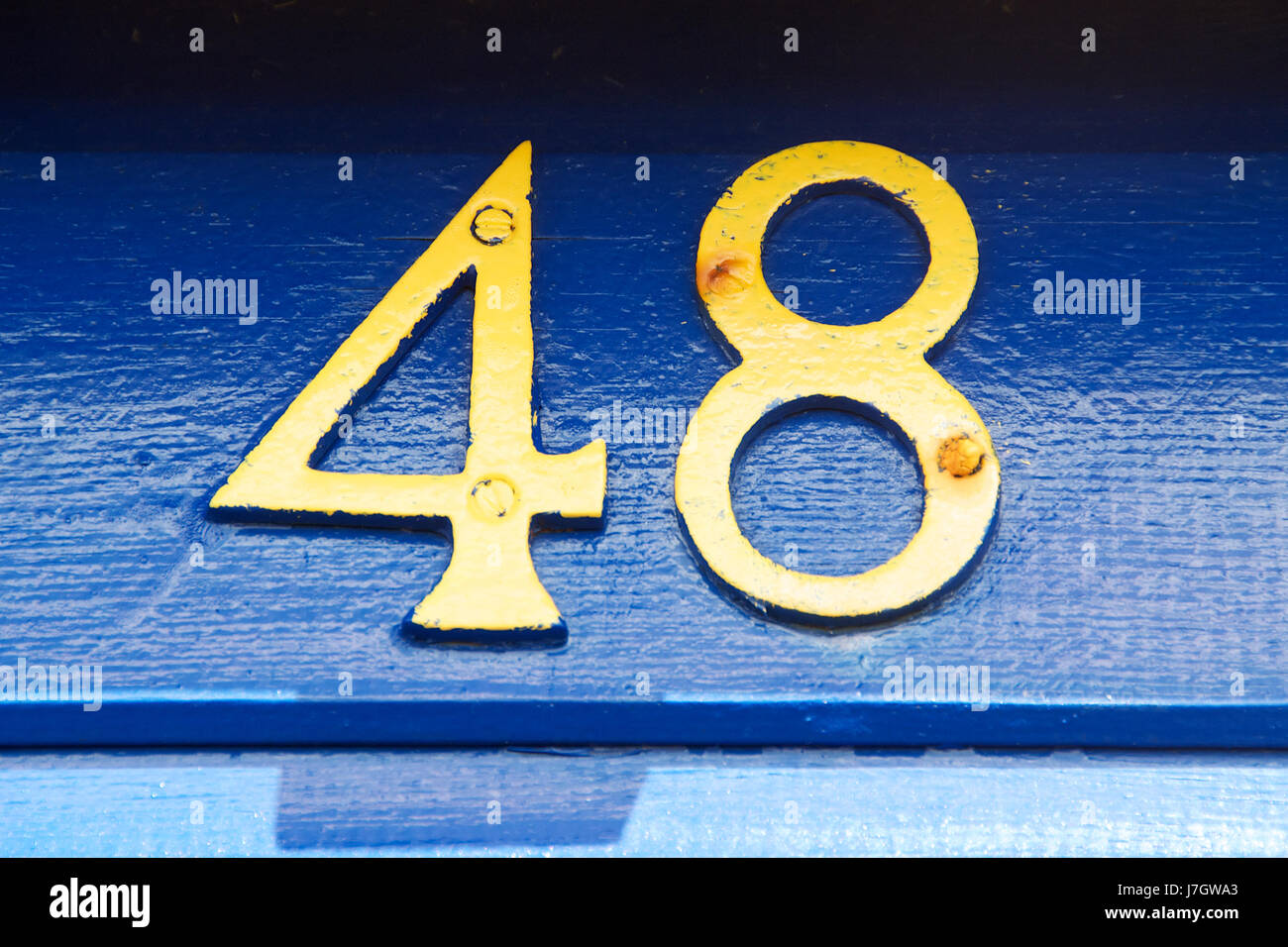 The number 48 on a beach hut Stock Photo - Alamy