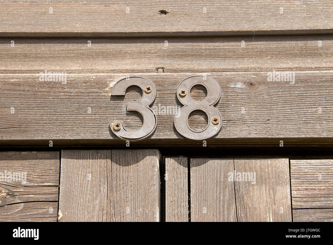 The number 38 on a beach hut Stock Photo - Alamy