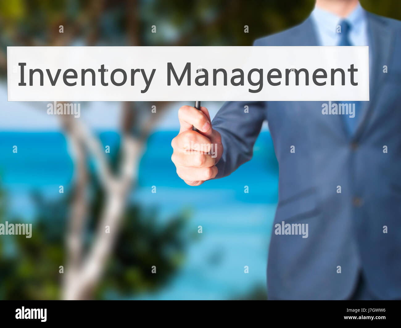Inventory Management - Businessman hand holding sign. Business ...