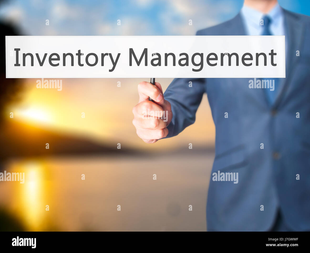 Inventory Management - Businessman hand holding sign. Business ...
