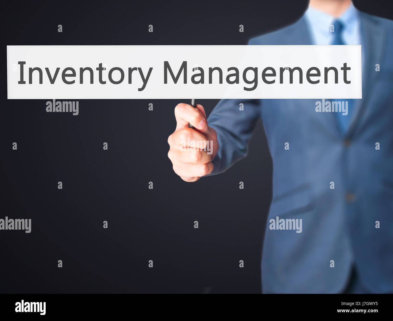Inventory Management - Businessman hand holding sign. Business ...