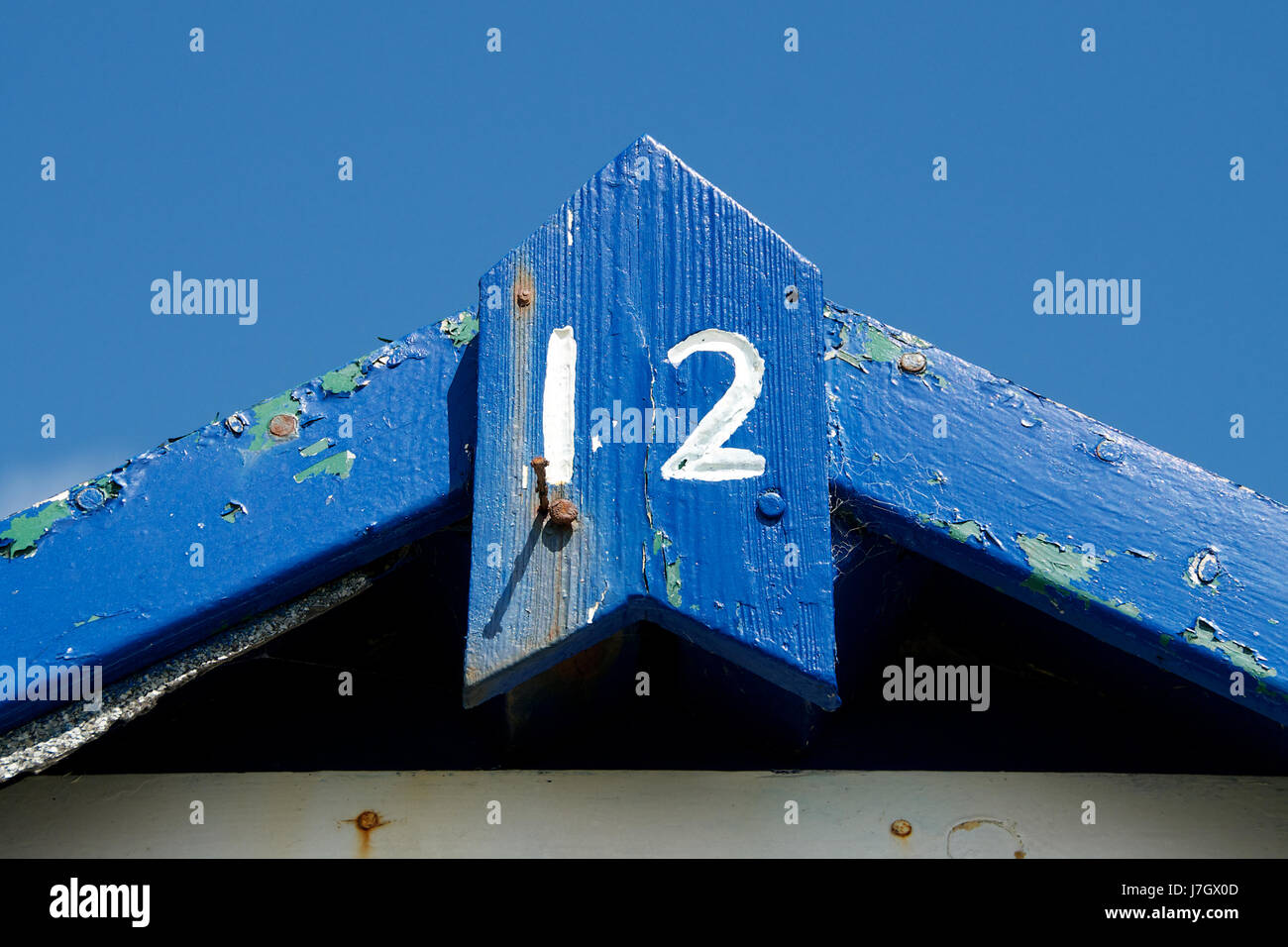 The number 12 on a beach hut Stock Photo - Alamy