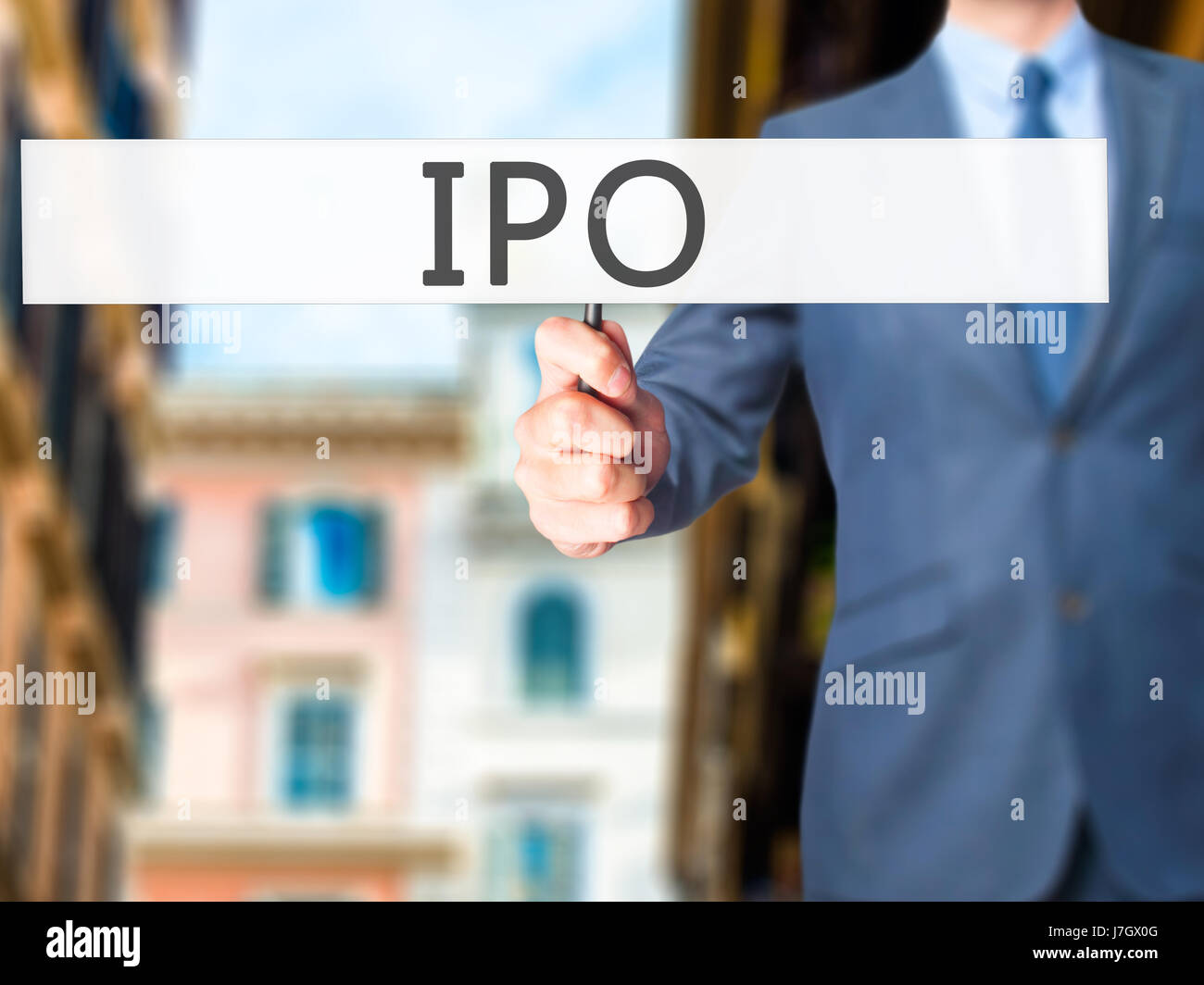 IPO - Businessman hand holding sign. Business, technology, internet ...