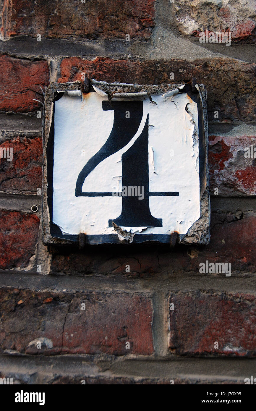 The number 4 on a wall Stock Photo - Alamy