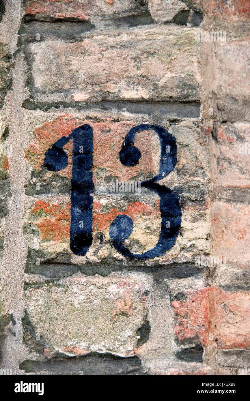 The number 13 on a wall Stock Photo - Alamy