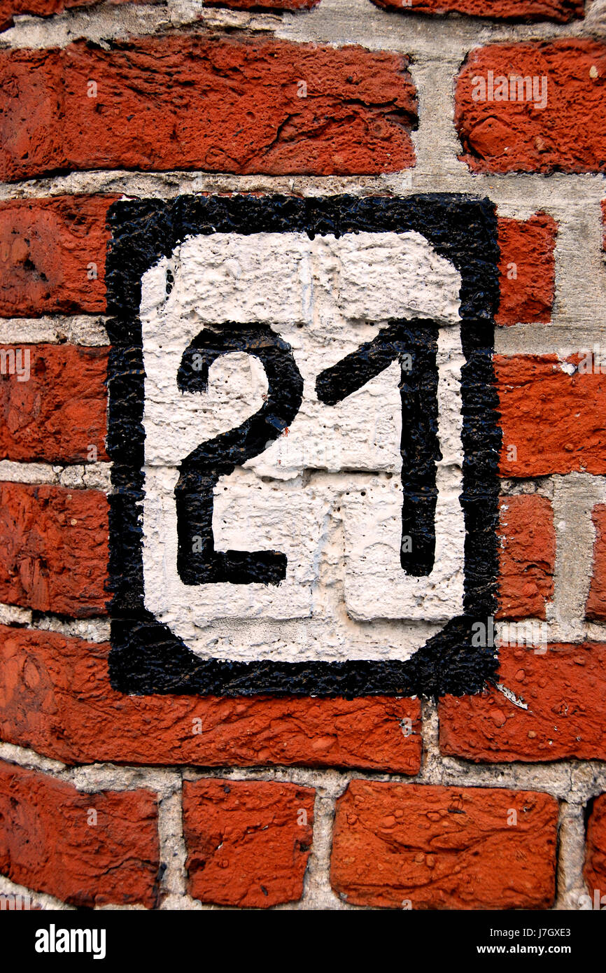 The number 21 on a wall Stock Photo - Alamy