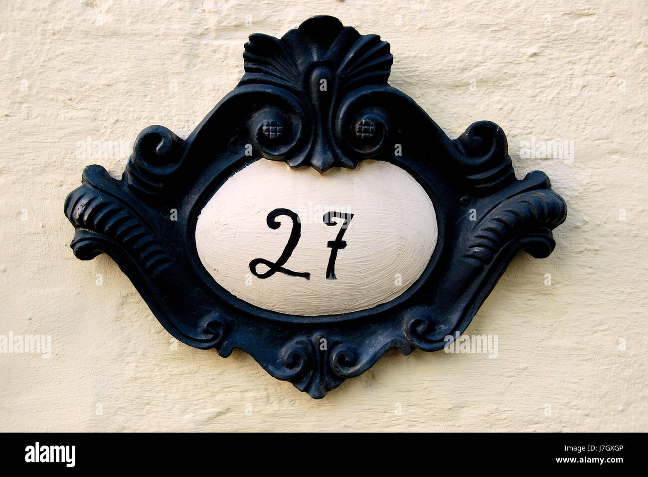 The number 27 on a wall Stock Photo - Alamy