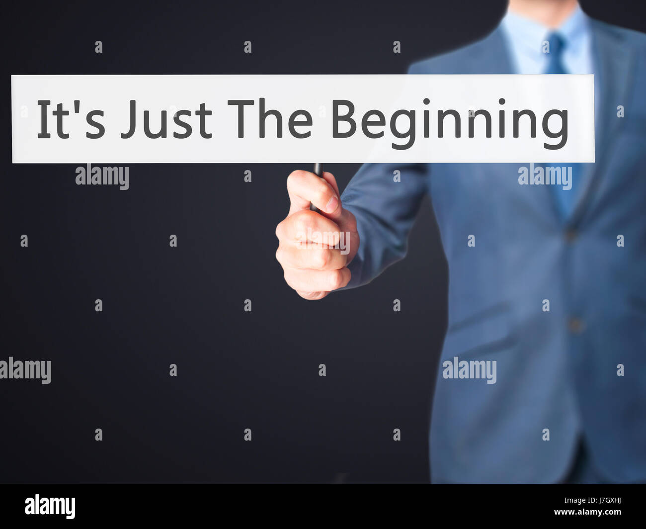 It's Just The Beginning - Businessman hand holding sign. Business ...