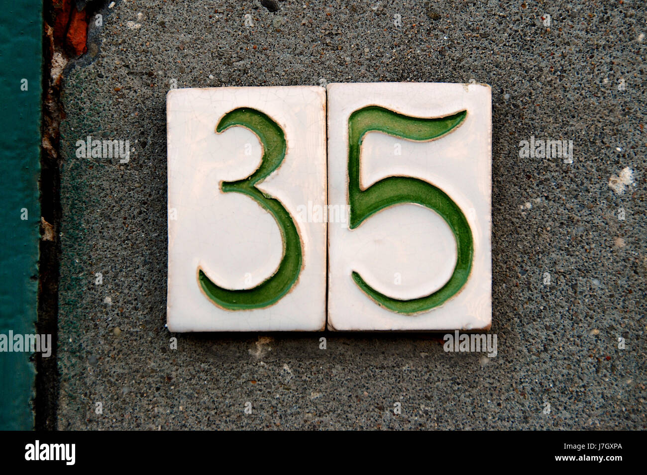The number 35 on a wall Stock Photo - Alamy