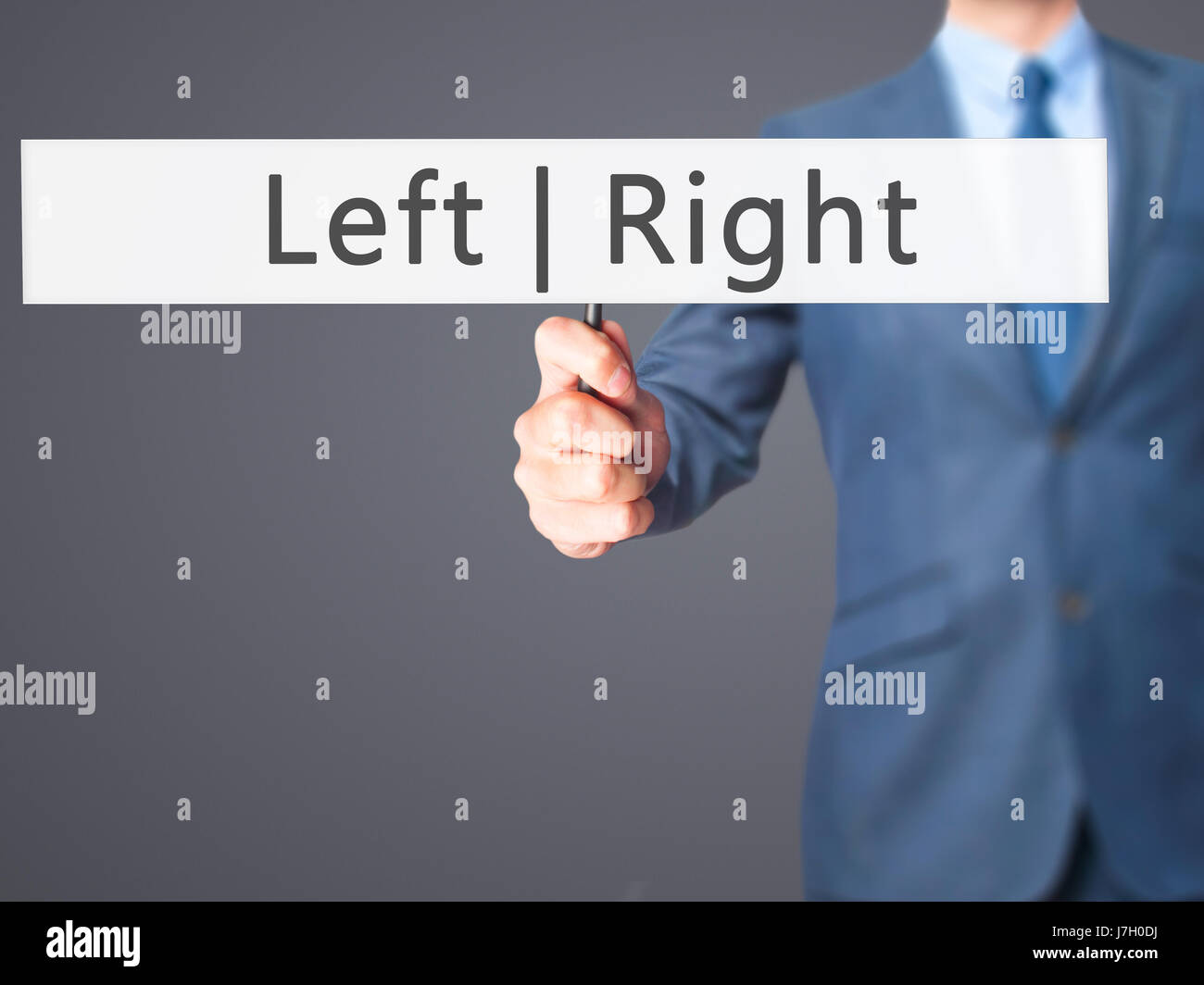 Left Right - Businessman hand holding sign. Business, technology ...