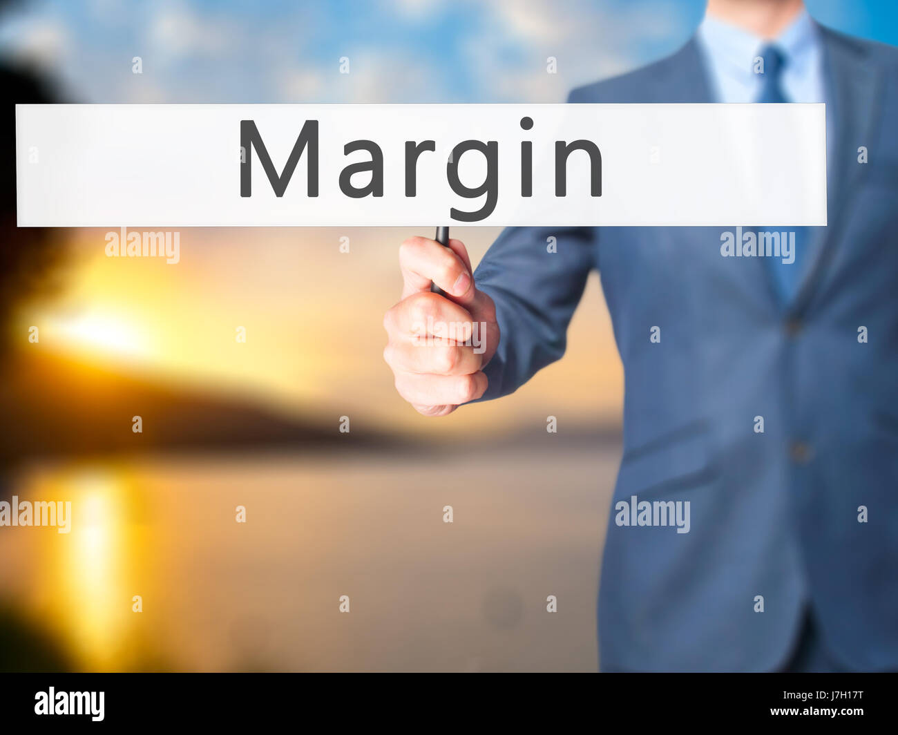Margin - Businessman hand holding sign. Business, technology, internet ...