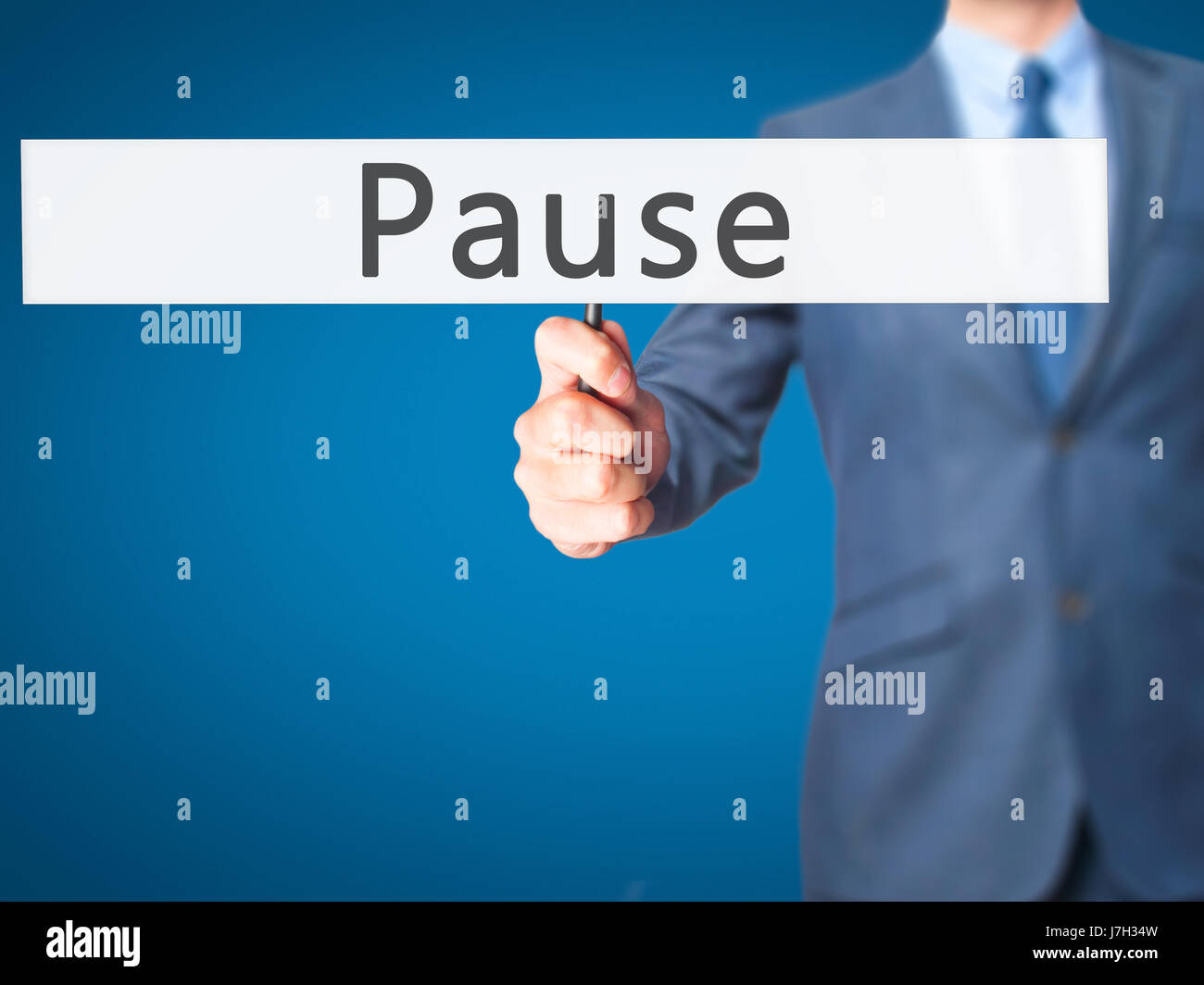 Pause - Businessman hand holding sign. Business, technology, internet ...