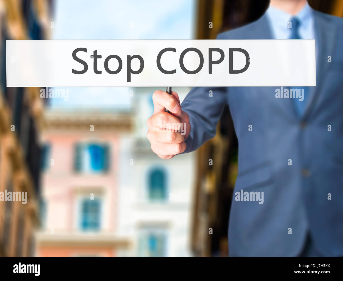 Stop COPD - Businessman hand holding sign. Business, technology ...