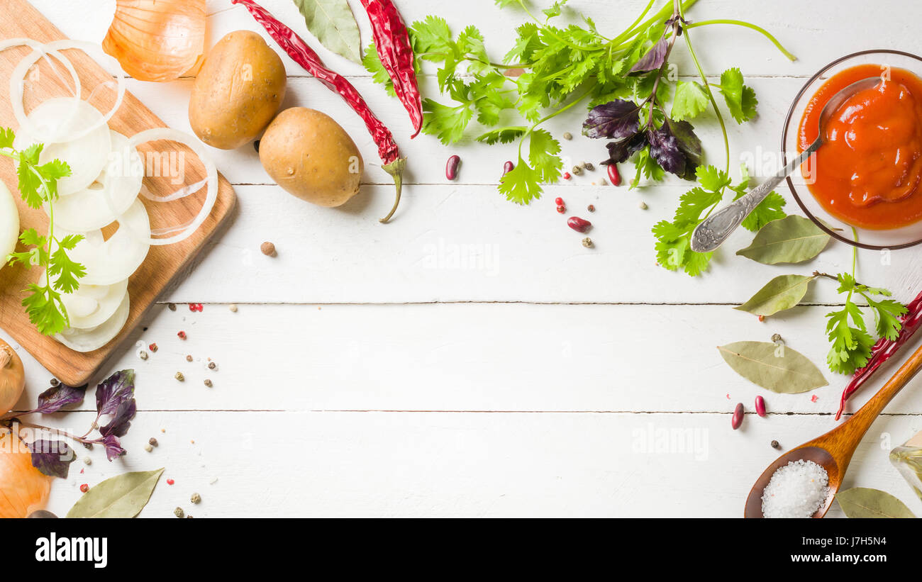 Preparation of soup at home. Rustic white background with vegetables ...