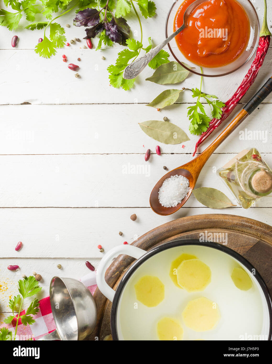 Preparation of soup at home. Rustic white background with vegetables ...