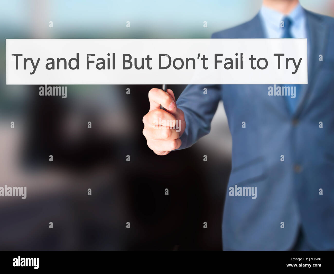 Try and Fail But Dont Fail to Try - Businessman hand holding sign ...