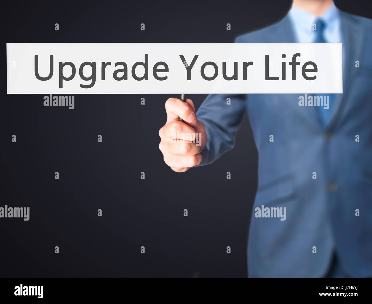 Upgrade Your Life - Businessman hand holding sign. Business, technology ...