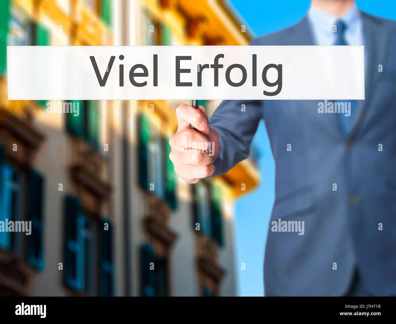 Viel Erfolg (Much Success In German) - Businessman hand holding sign ...