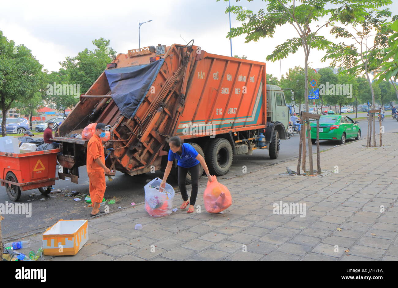 People collect garbage in downtown Ho Chi Minh city Vietnam Stock Photo ...