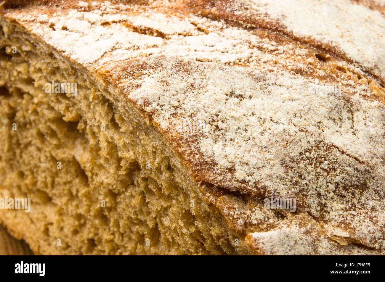 cut malt bread handmade on wooden background Stock Photo - Alamy