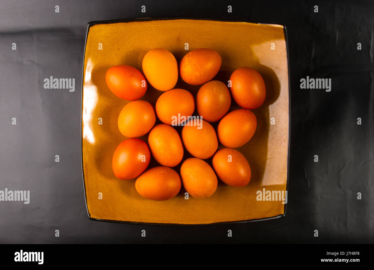 eggs colored with natural dye on brown dish Stock Photo - Alamy