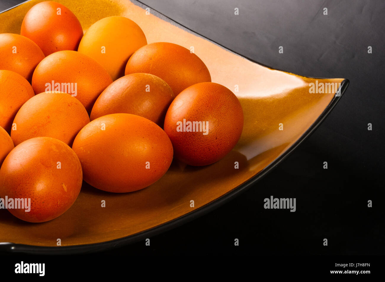 eggs colored with natural dye on brown dish Stock Photo - Alamy