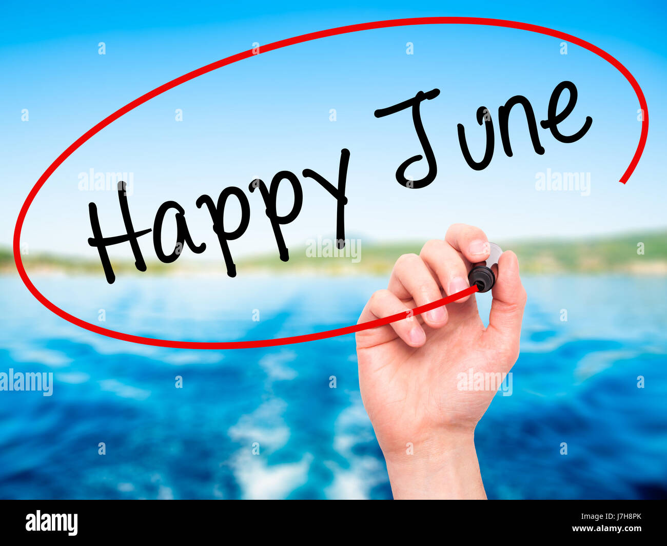 Man Hand writing Happy June with black marker on visual screen ...
