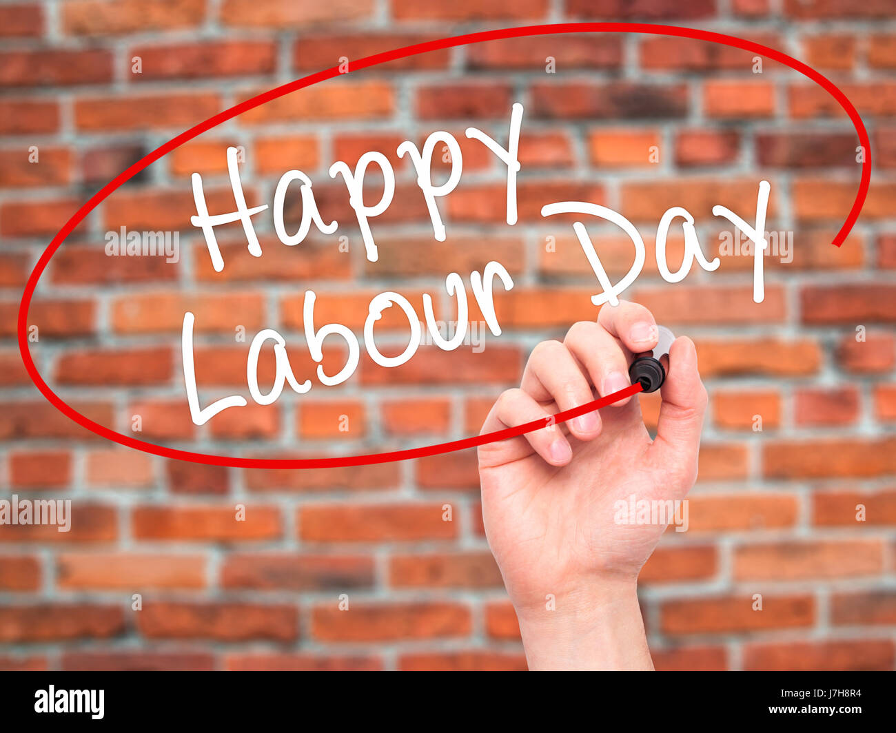 Man Hand writing Happy Labor Day with black marker on visual screen ...