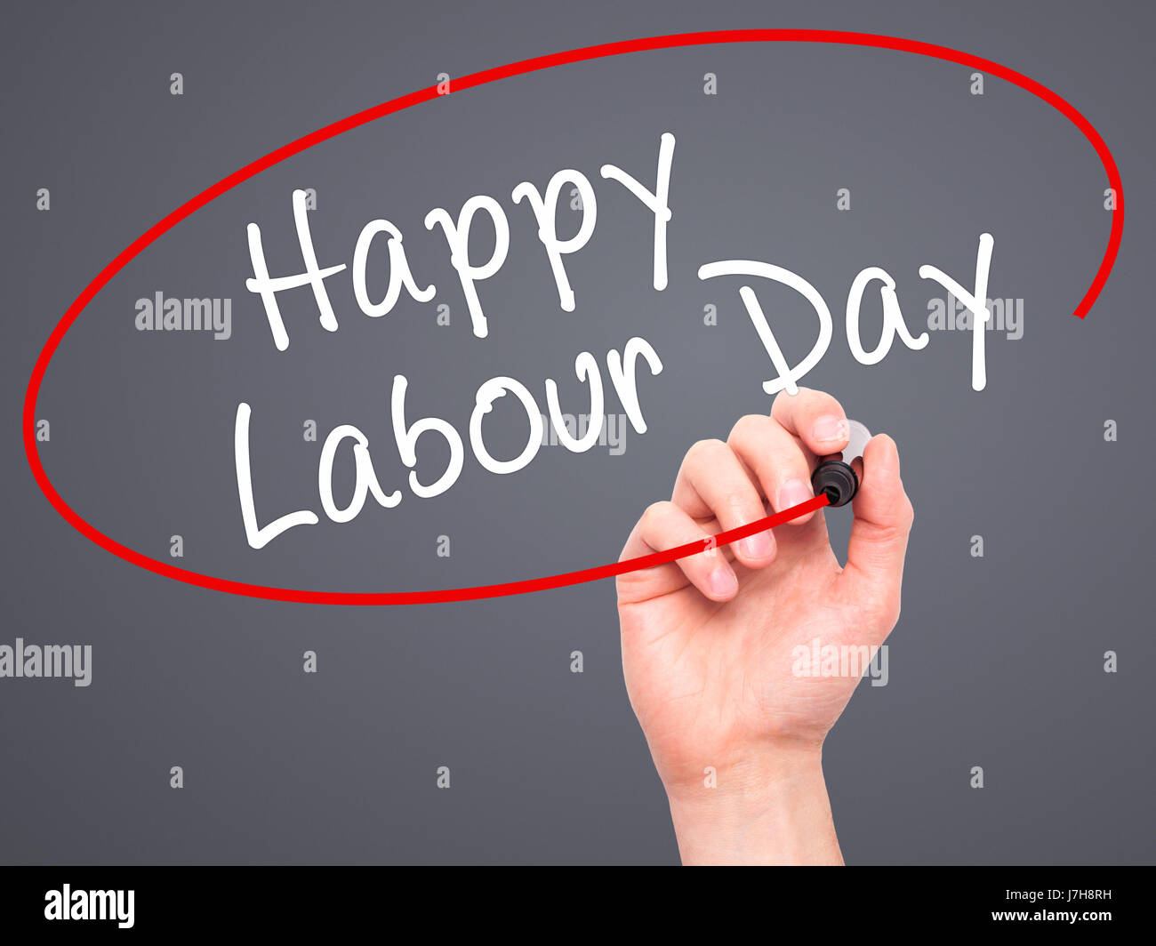 Man Hand writing Happy Labor Day with black marker on visual screen ...