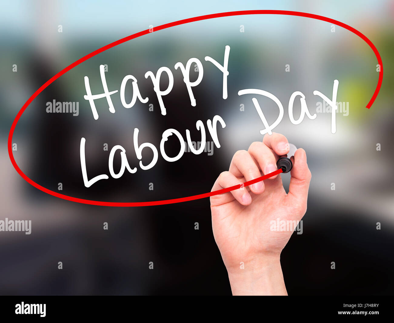 Man Hand writing Happy Labor Day with black marker on visual screen ...