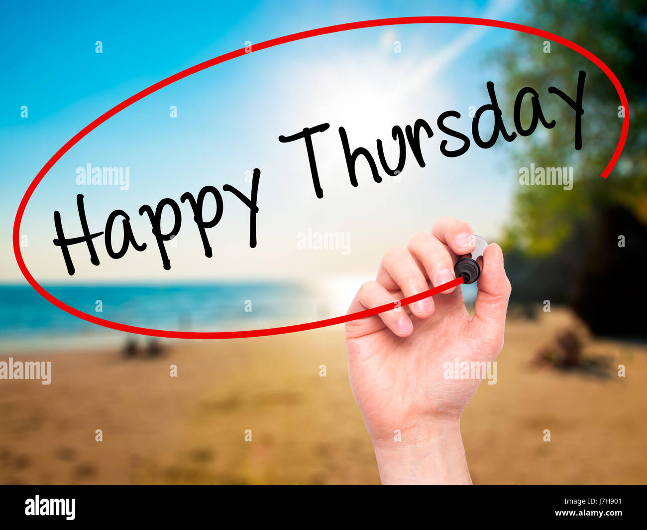 Man Hand writing Happy Thursday with black marker on visual screen ...