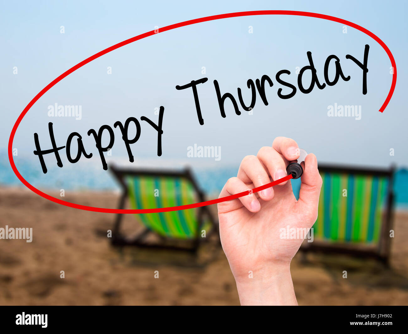 Man Hand writing Happy Thursday with black marker on visual screen ...