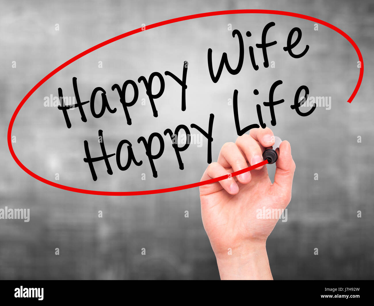 Man Hand writing Happy Wife Happy Life with black marker on visual ...