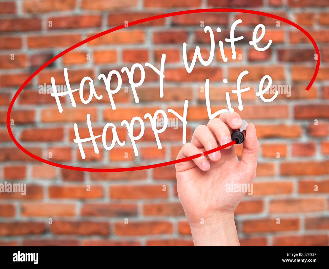 Man Hand writing Happy Wife Happy Life with black marker on visual ...