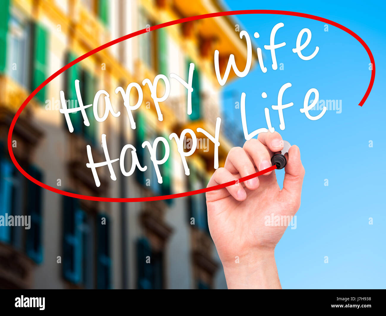 Man Hand writing Happy Wife Happy Life with black marker on visual ...