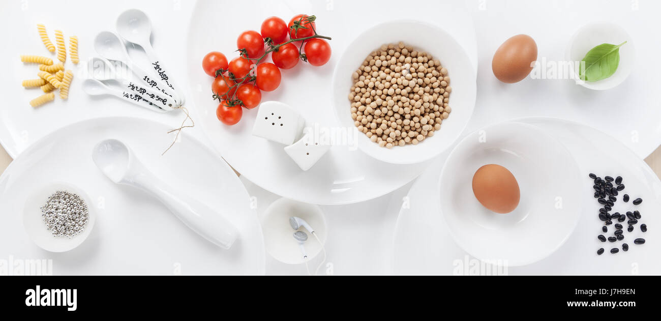 empty white plates of different sizes and food ingredients Stock Photo ...
