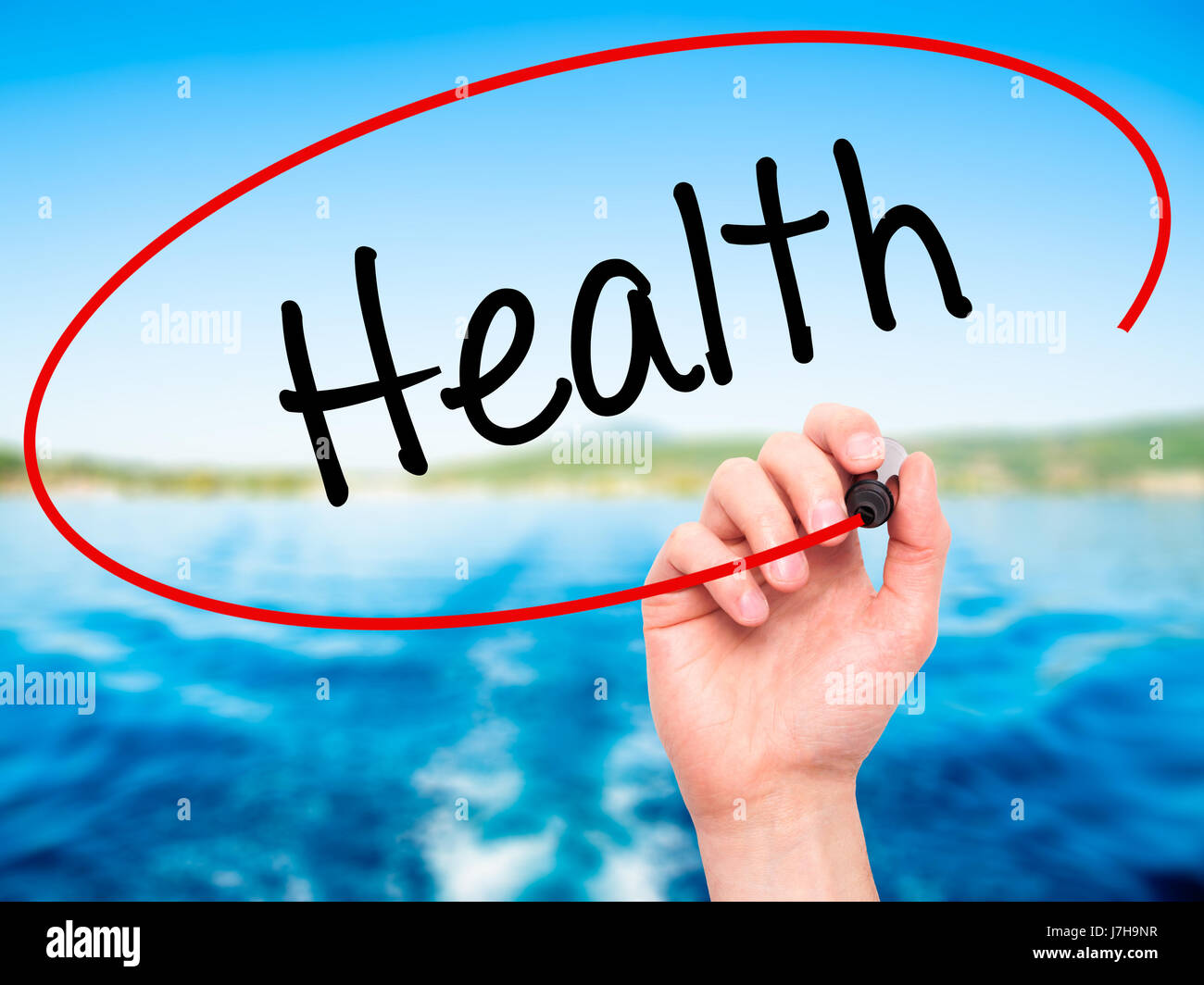 Man Hand writing Health with black marker on visual screen. Isolated on ...