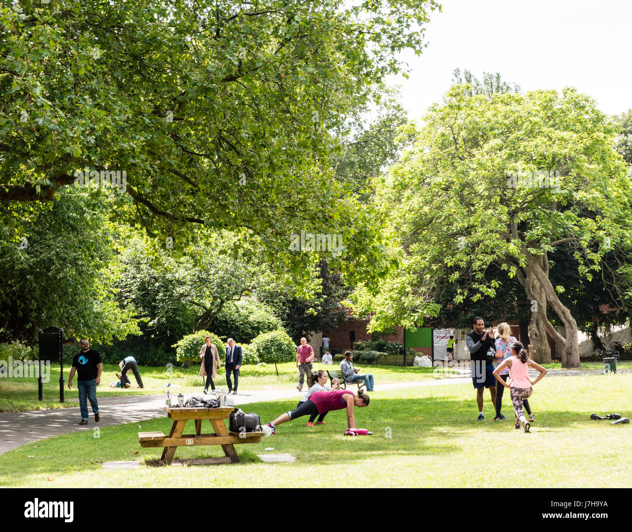 People doing exercises in a park in London Stock Photo - Alamy