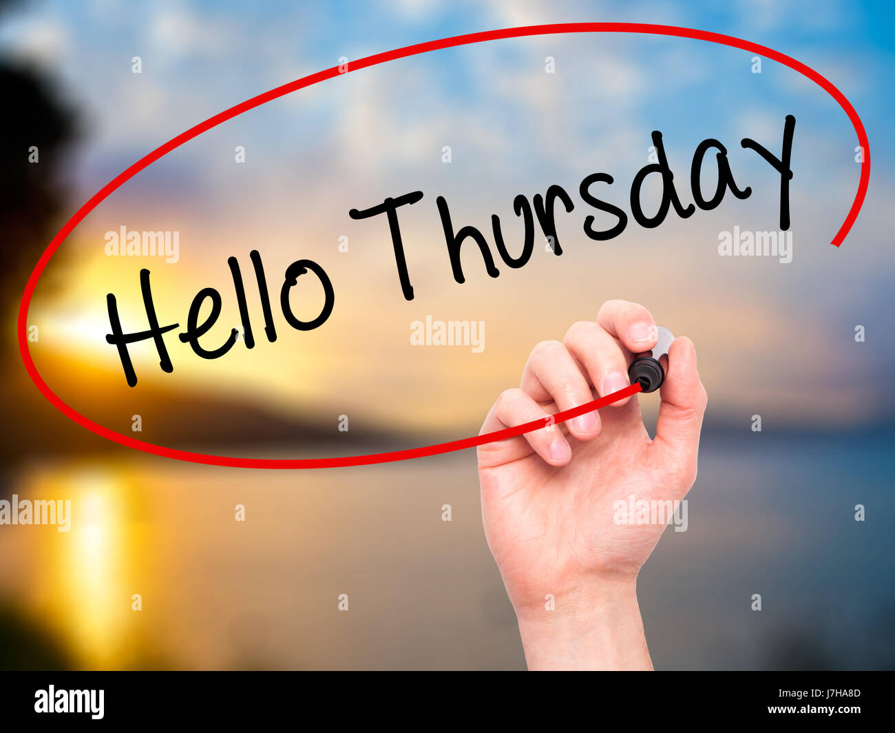 Man Hand writing Hello Thursday with black marker on visual screen ...