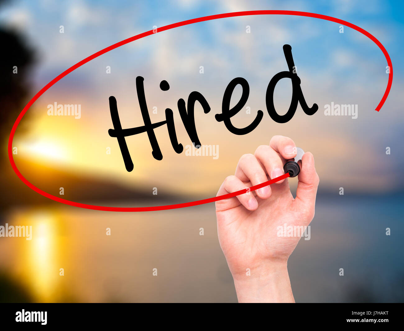 Man Hand writing Hired with black marker on visual screen. Isolated on ...