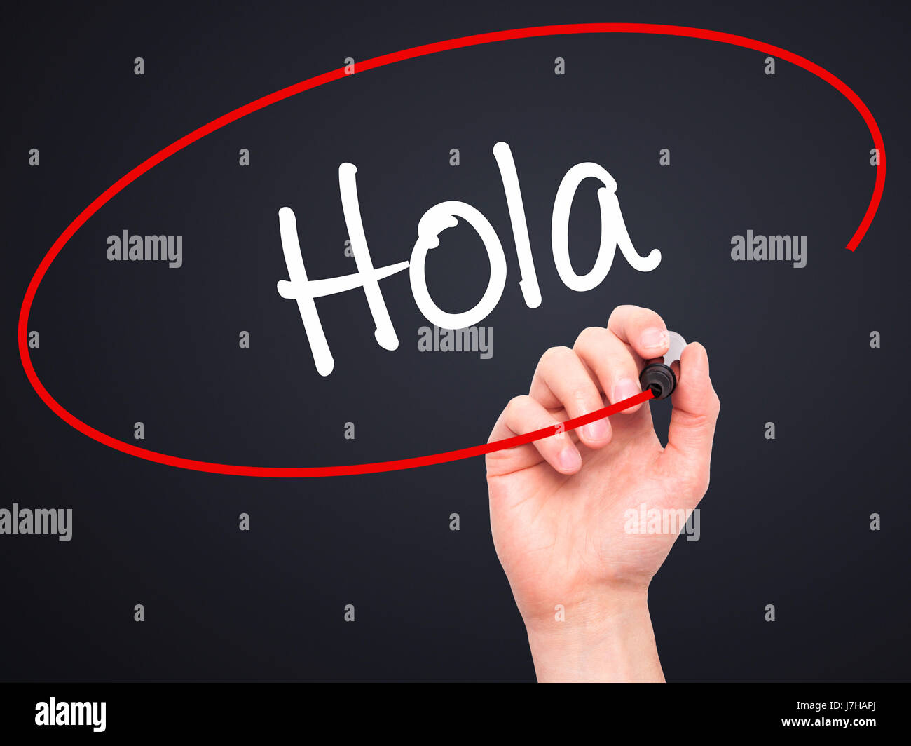 Man Hand writing Hola (Hello in Spanish) with black marker on visual ...