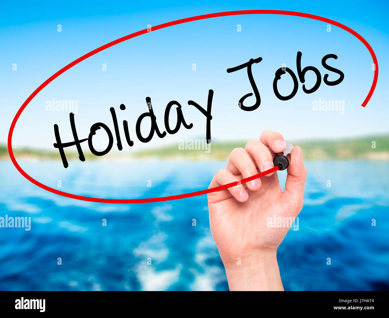 Man Hand writing Holiday Jobs with black marker on visual screen ...