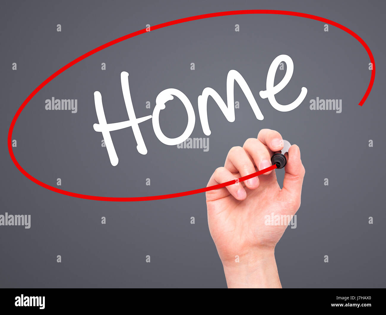 Man Hand writing Home with black marker on visual screen. Isolated on ...