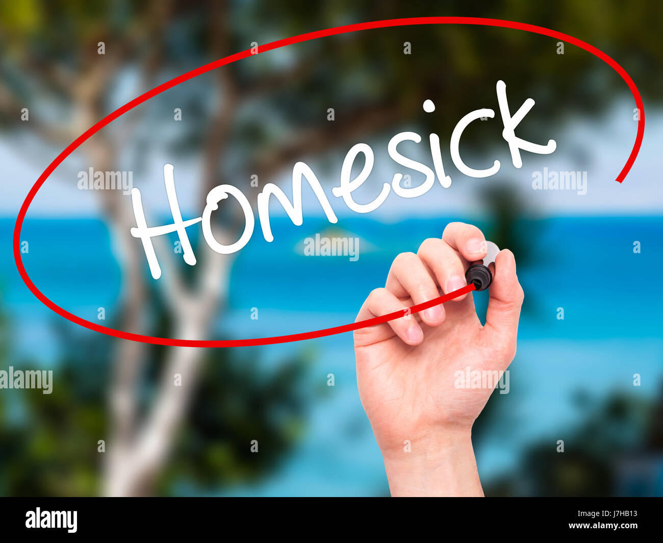 Man Hand writing Homesick with black marker on visual screen. Isolated ...