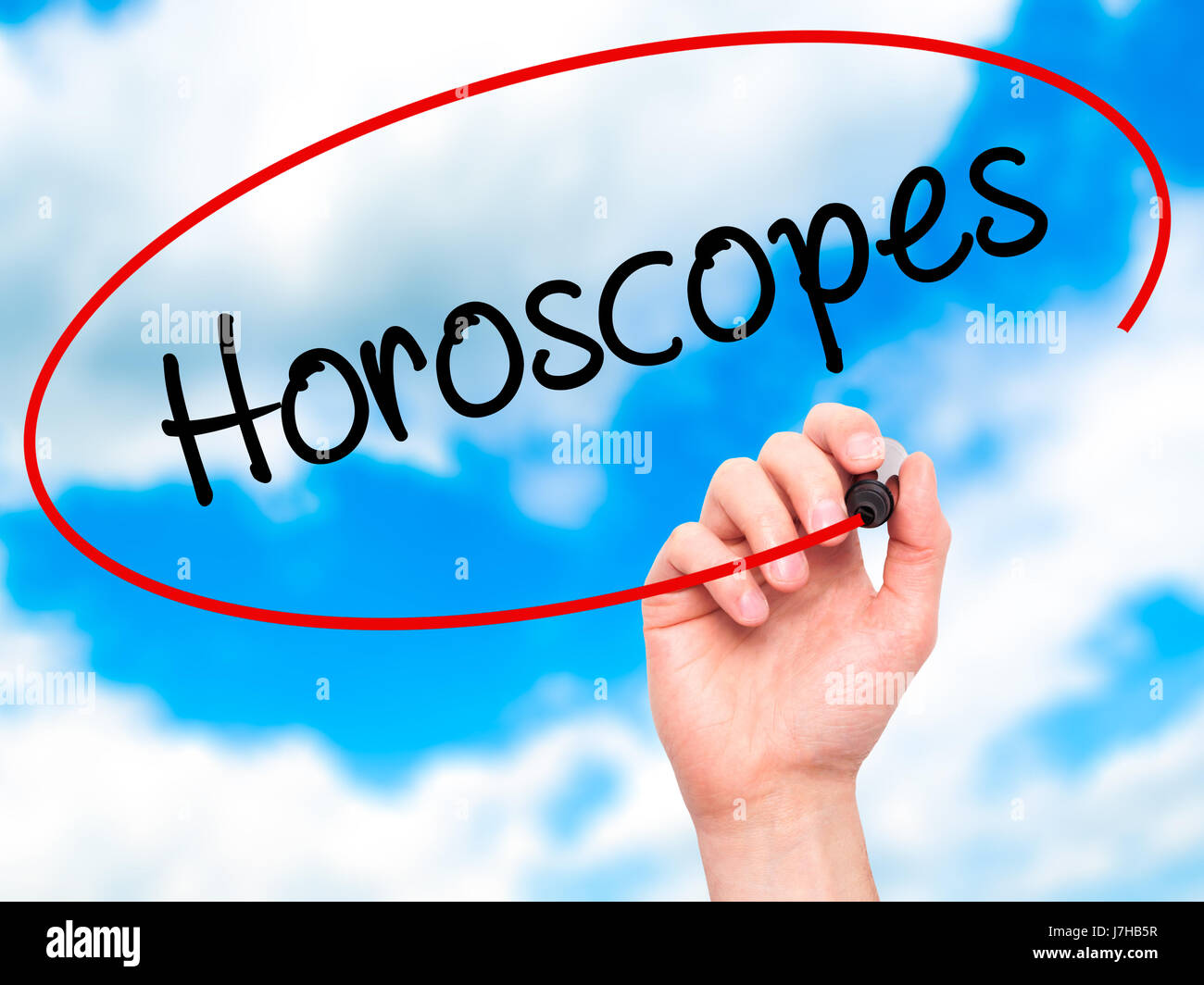Man Hand writing Horoscopes with black marker on visual screen ...