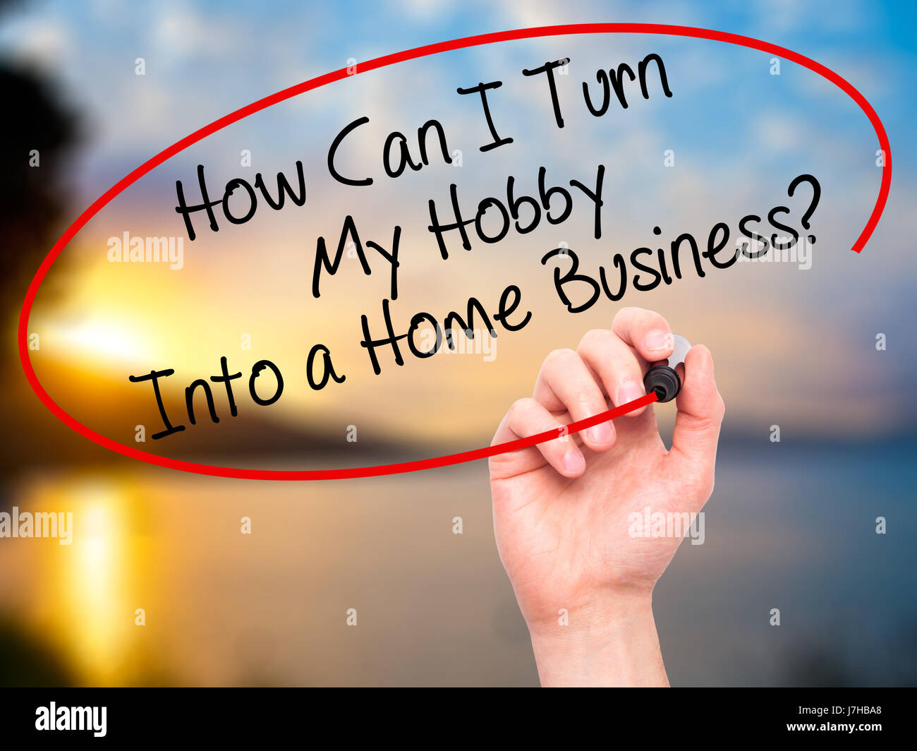 Man Hand writing How Can I Turn My Hobby Into a Home Business? with ...