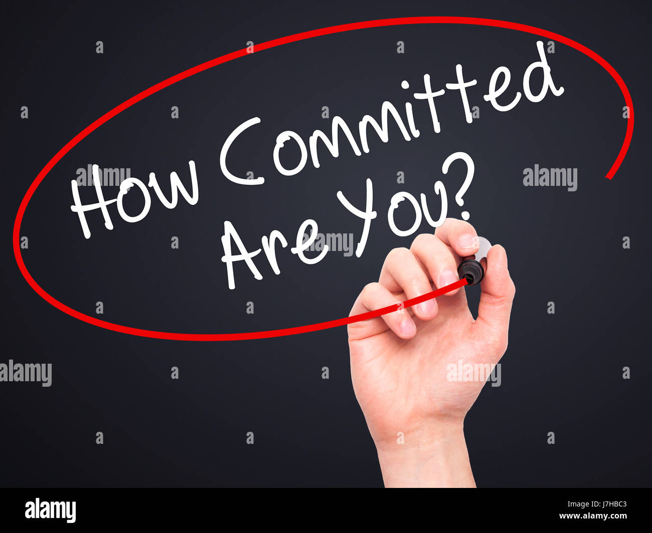 Man Hand writing How Committed Are You? with black marker on visual ...