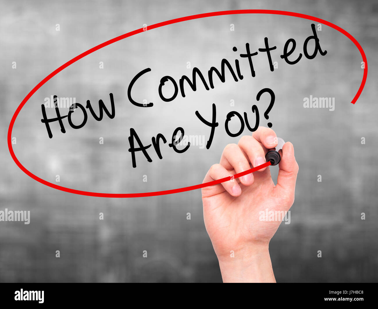Man Hand writing How Committed Are You? with black marker on visual ...