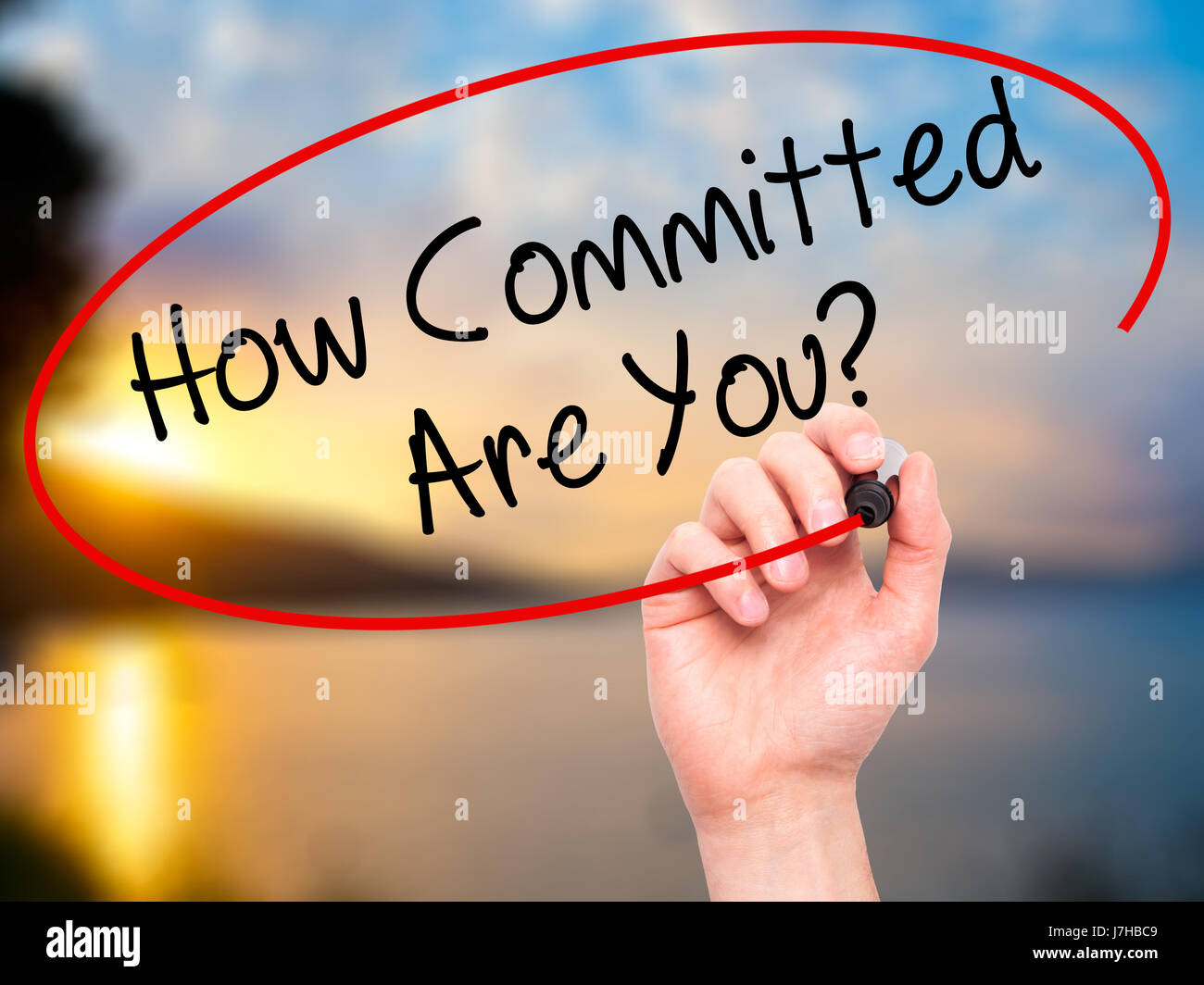 Man Hand writing How Committed Are You? with black marker on visual ...